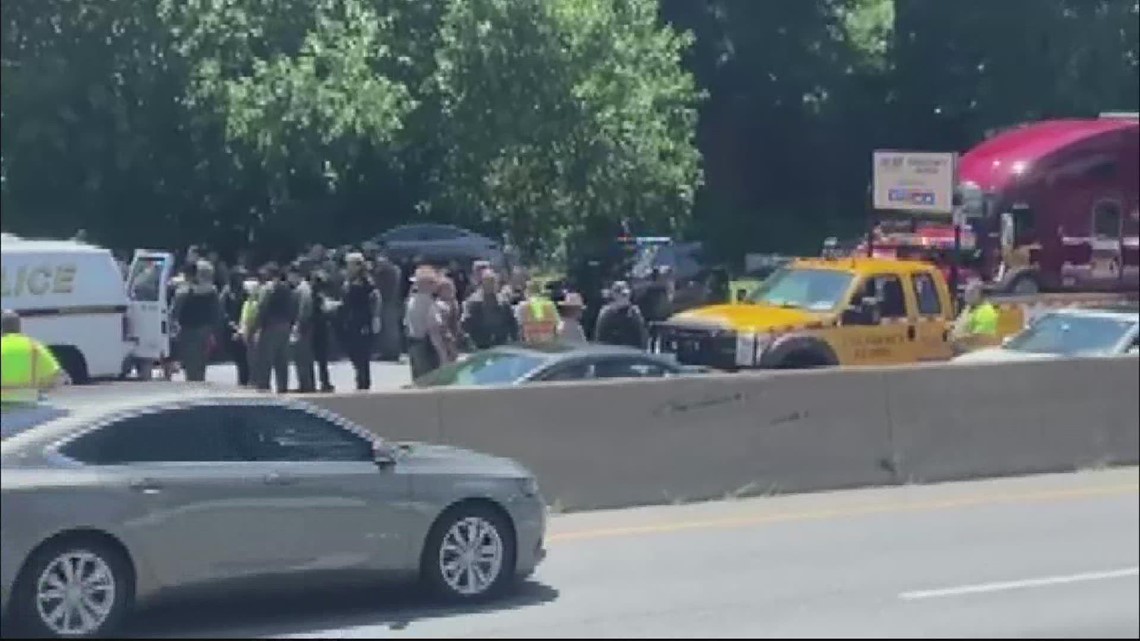 Climate protesters sitting on roadway block lanes of I-495 inner loop ...