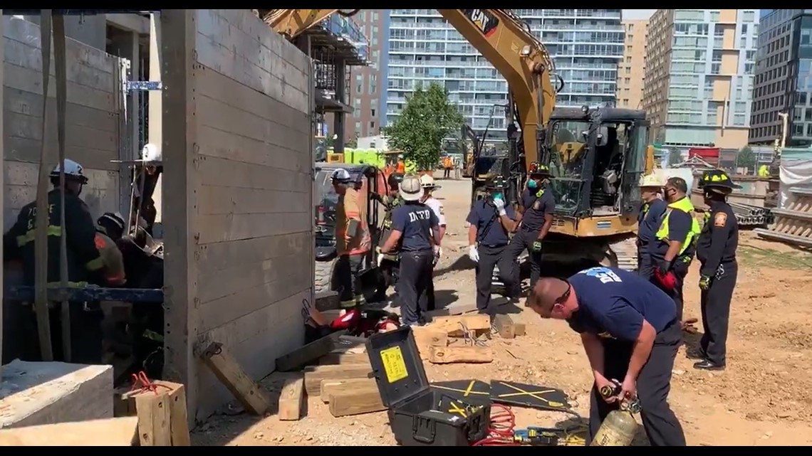 Firefighters rescue construction worker pinned under machinery | wusa9.com