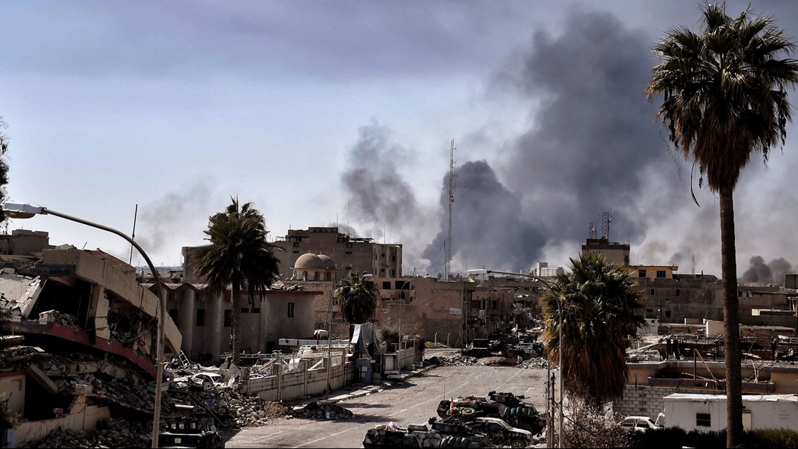 Iraqi forces hoist flag over Mosul as fighting continues | wusa9.com