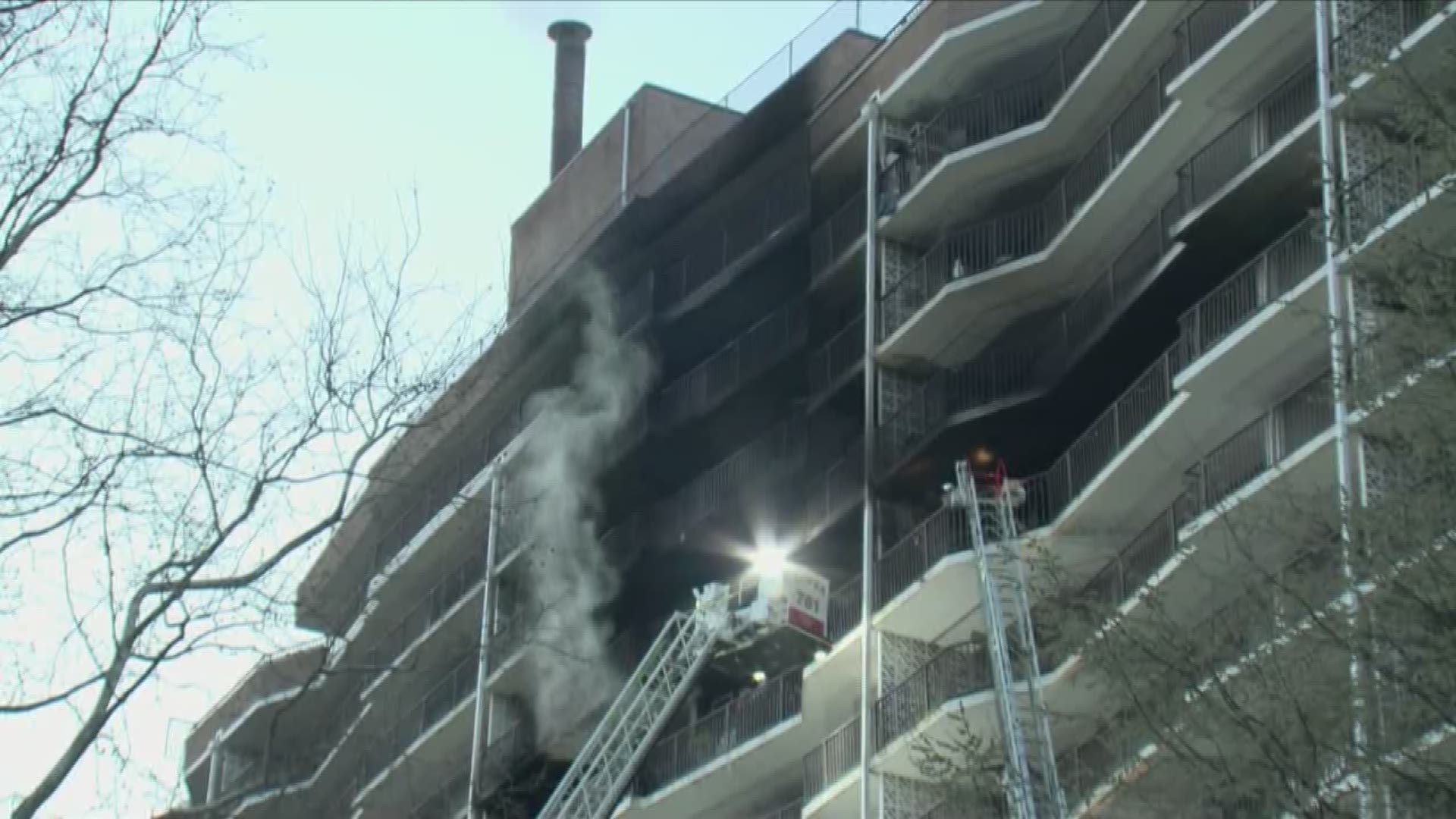 Residents evacuate after fire in bedroom at high rise apartment ...