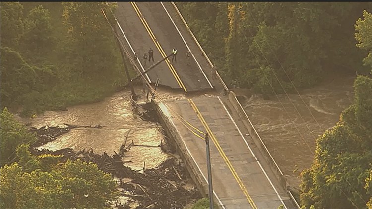 Road washed out, car swept away due to flood water in Laurel | wusa9.com