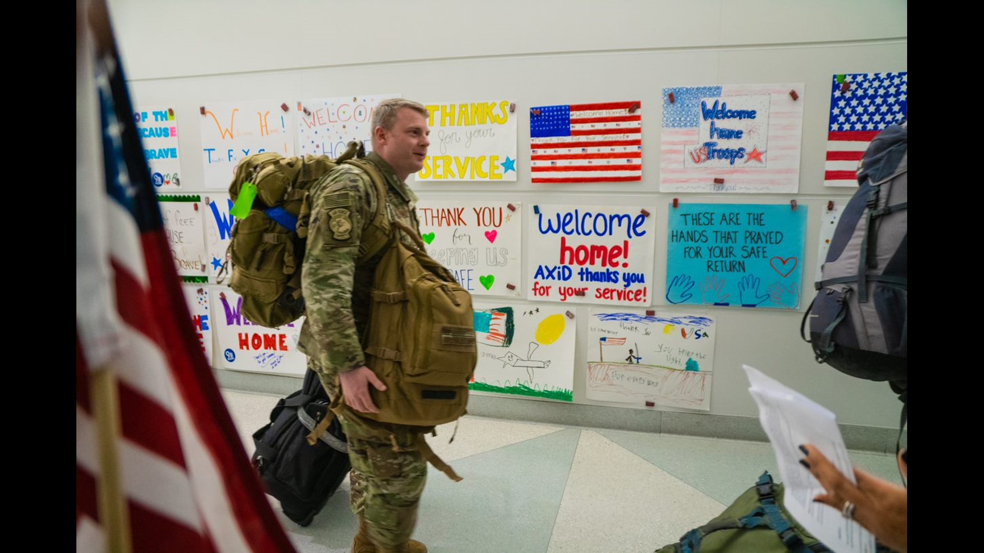 Welcome home: Community, family members greet military at airport ...