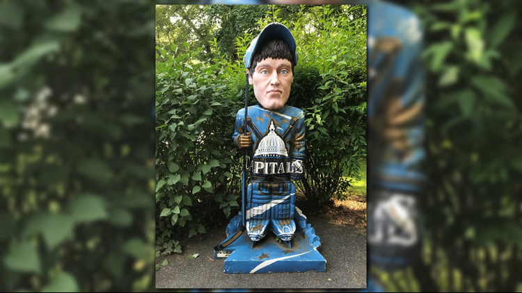 This couple has the biggest Caps bobblehead you've ever seen | wusa9.com