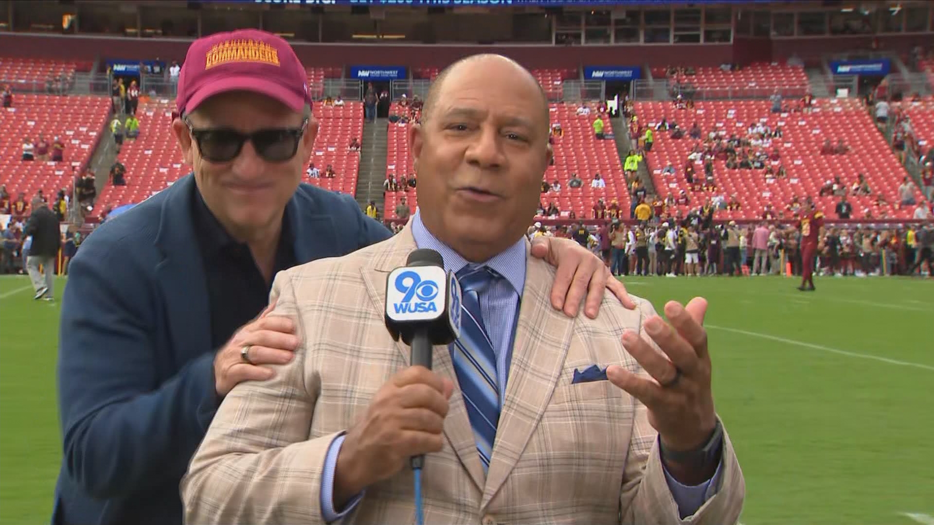 Josh Harris "photobombs" Chick Hernandez during Commanders Kickoff | wusa9.com