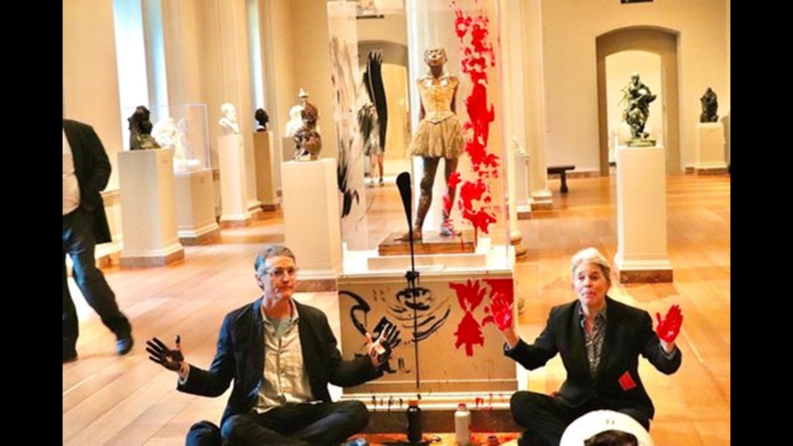 Demonstrators paint sculpture case at National Gallery of Art | wusa9.com