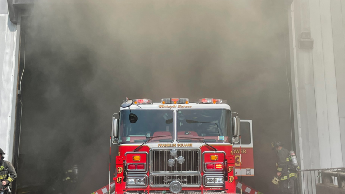 Crews battle 2-alarm fire at DC trash transfer station | wusa9.com
